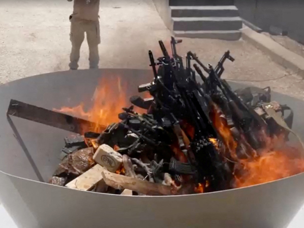 Kurdish PKK fighters burn weapons to start disarmament - RTHK
